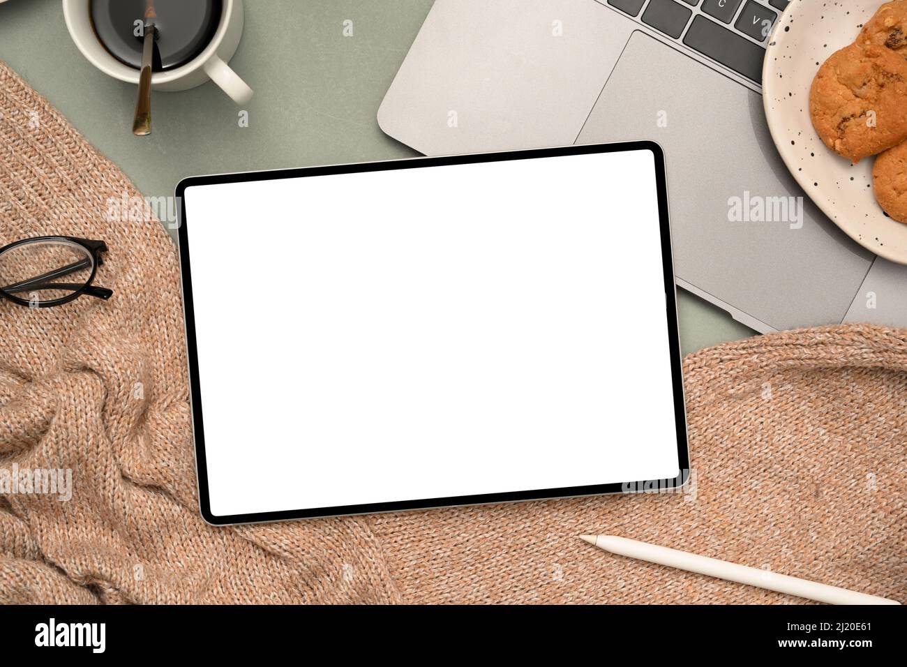 Overhead shot, Feminine office workspace with laptop computer, a cup of ...