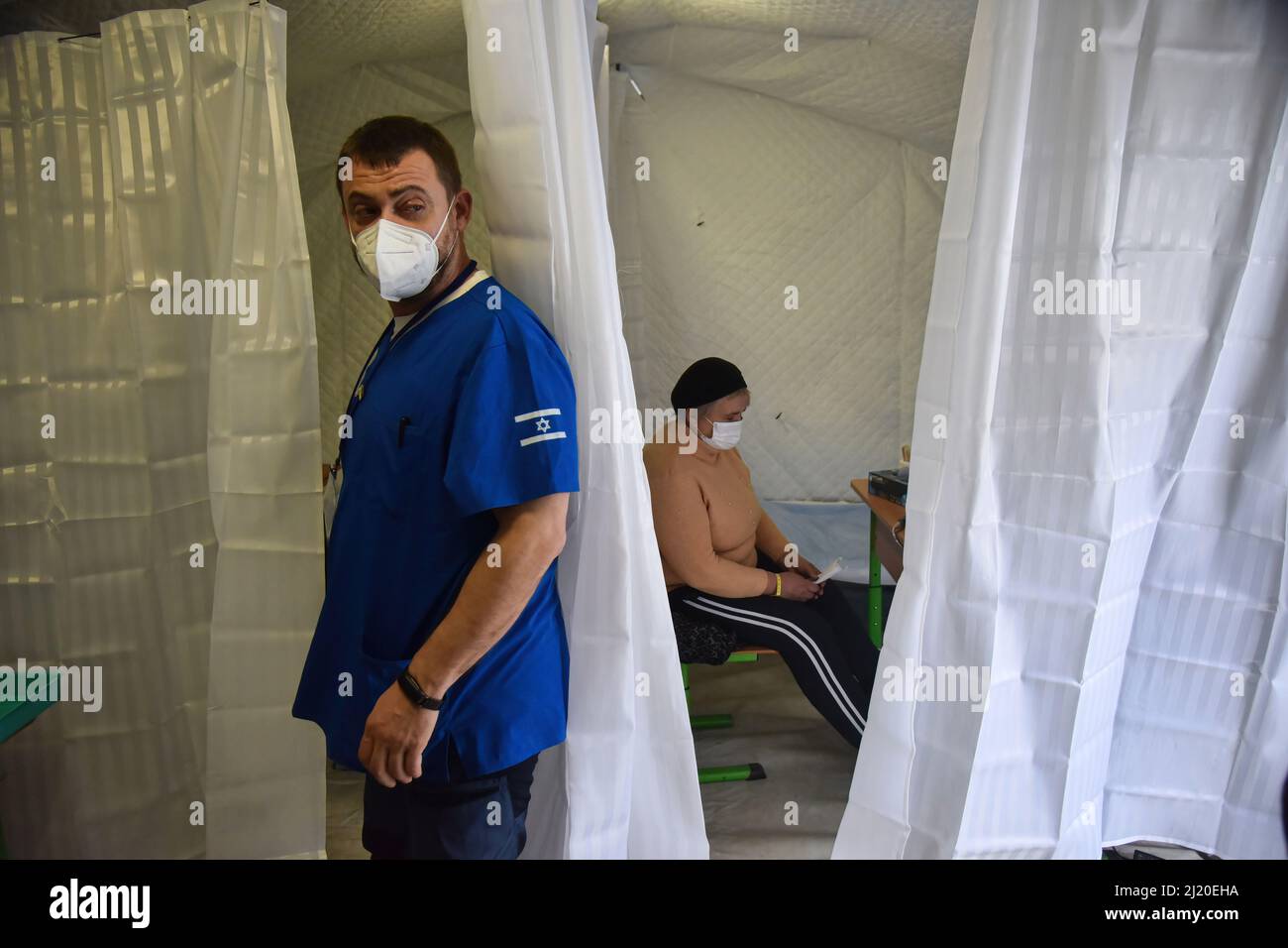 Mostyska, Ukraine. 26th Mar, 2022. Israeli doctor at a field hospital ...