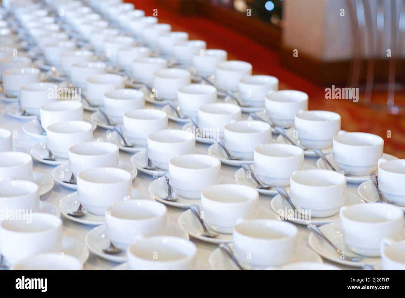 Hot coffee cup row with spoon in hotel seminar room Stock Photo - Alamy