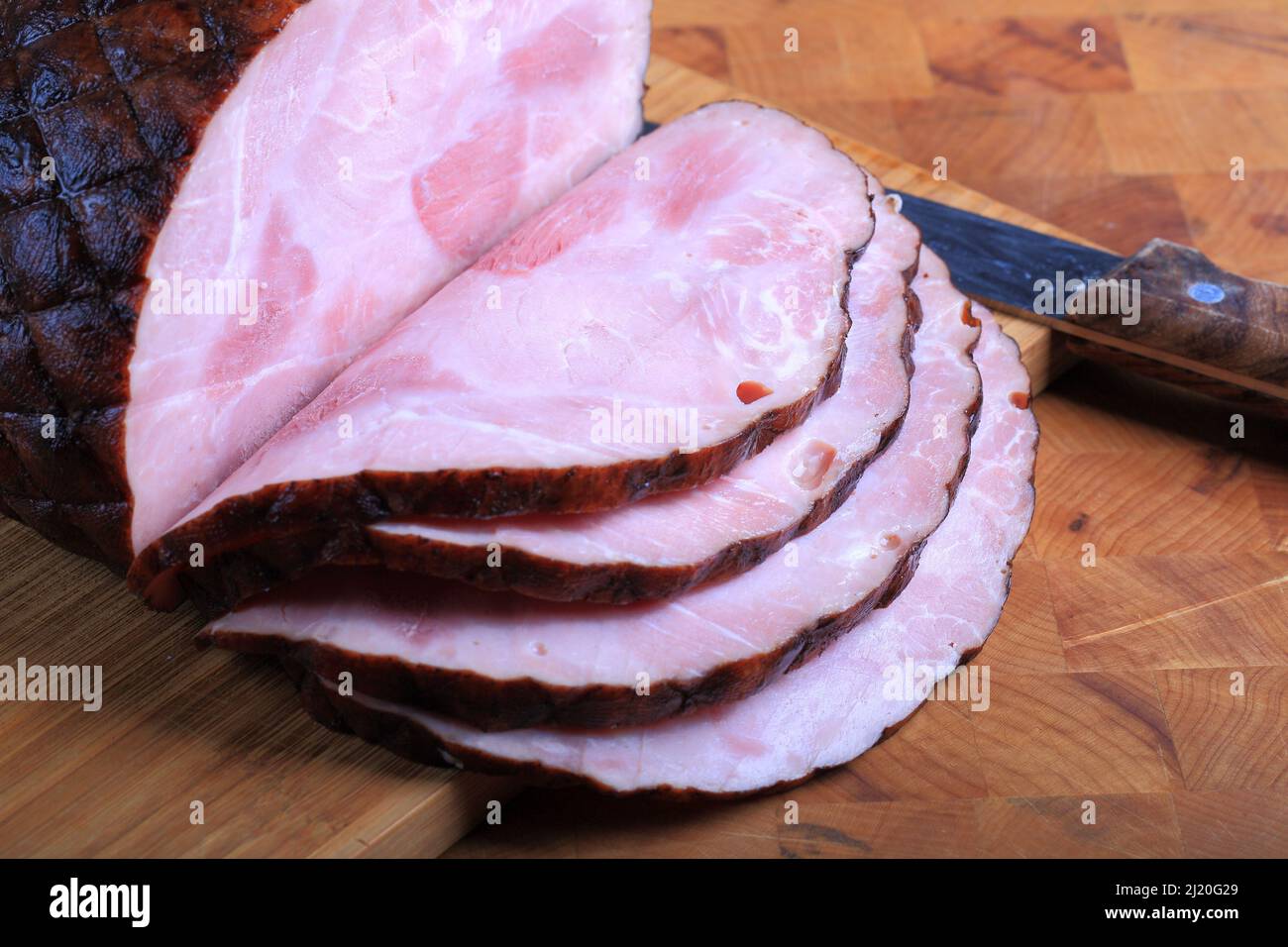 Cutting organic honey ham on hi-res stock photography and images - Alamy