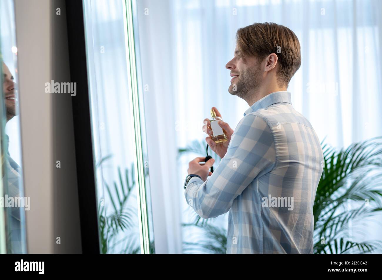 Man spraying perfume hi-res stock photography and images - Alamy