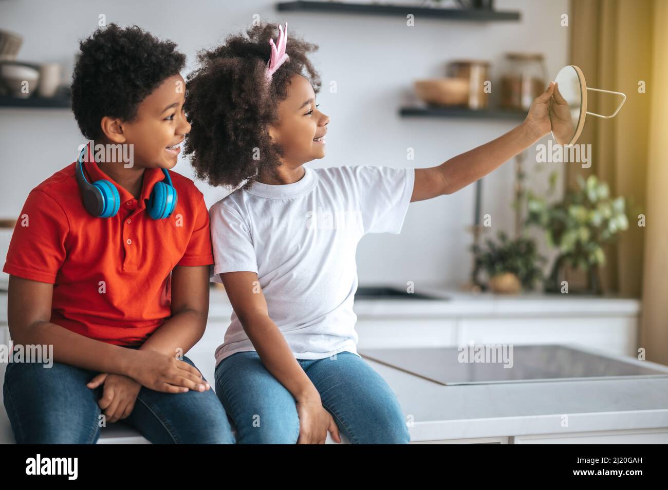 Two sibling having good time at home and feeling joyful Stock Photo - Alamy