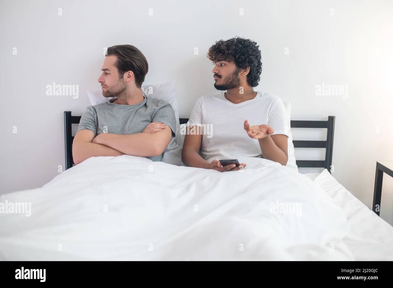 Offended male ignoring his partner after the conflict Stock Photo - Alamy