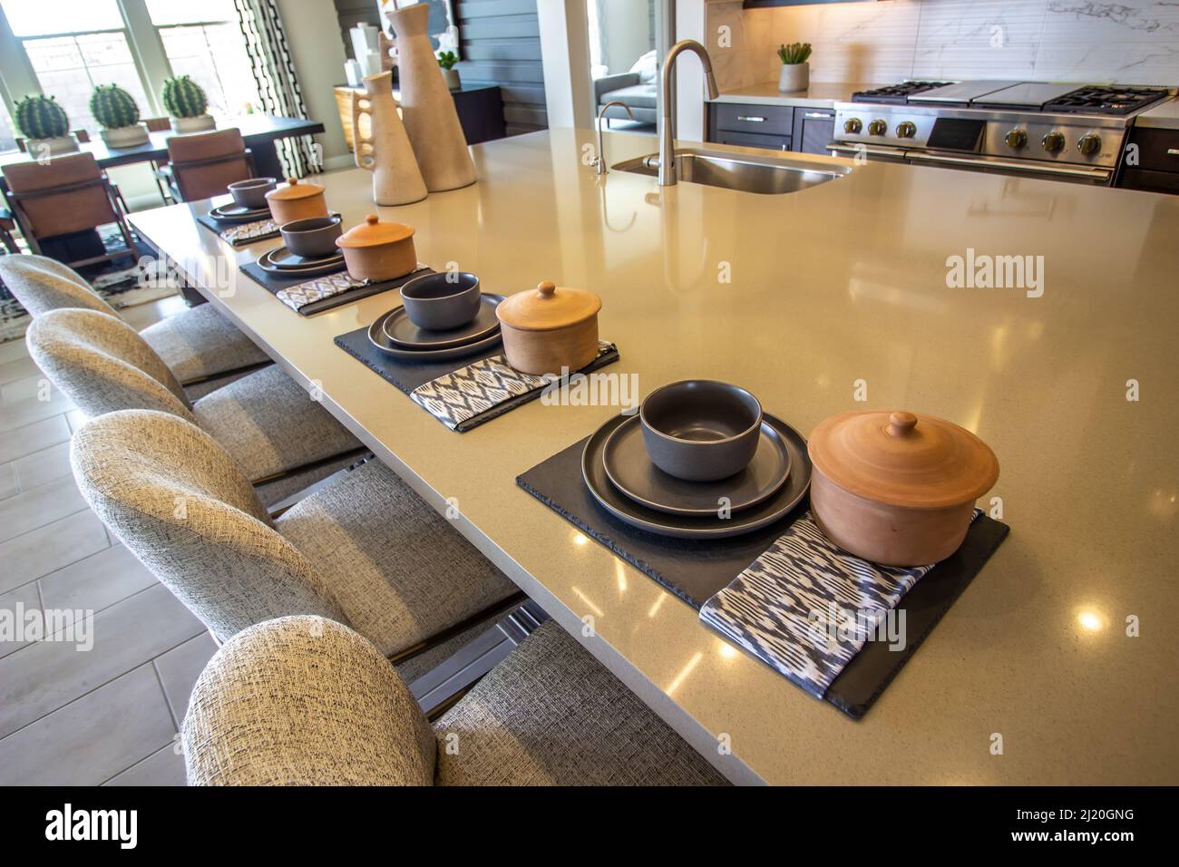 Kitchen Island Counter Top With Four Place Settings Stock Photo - Alamy
