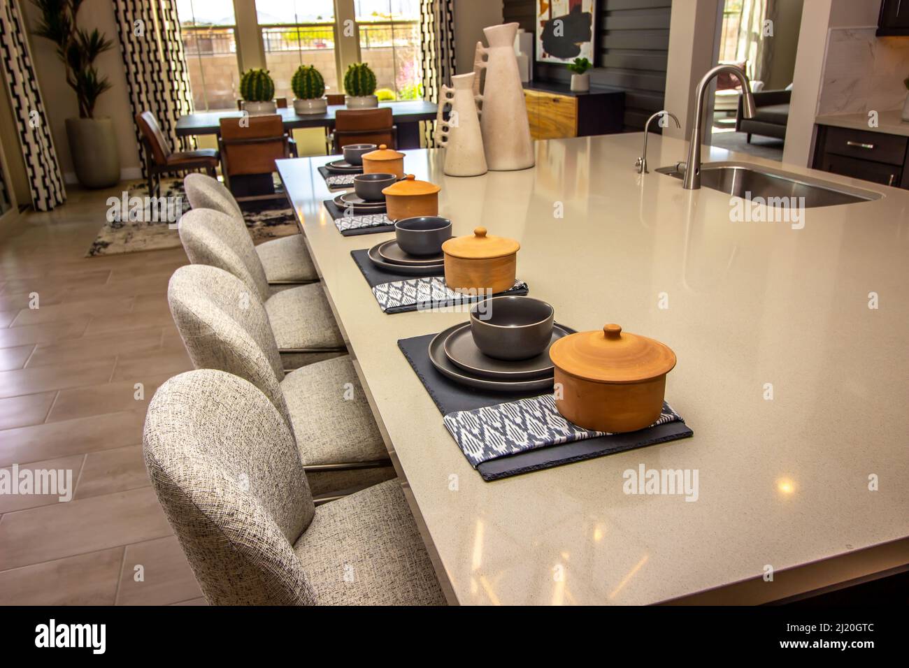 Kitchen Island Counter Top With Four Place Settings Stock Photo - Alamy