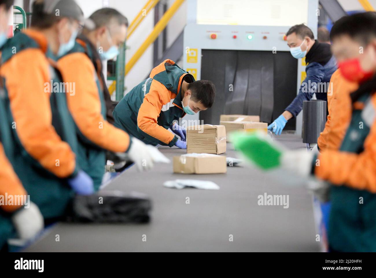 CHENZHOU, CHINA - MARCH 28, 2022 - Workers sort express packages at the ...
