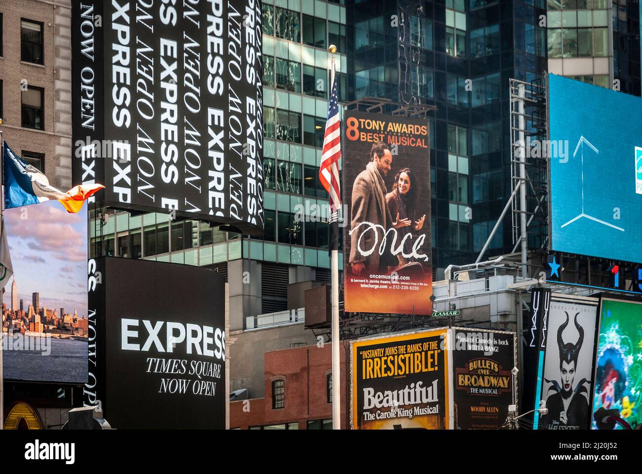 Electronic advertising billboards lining sides of the buildings on ...