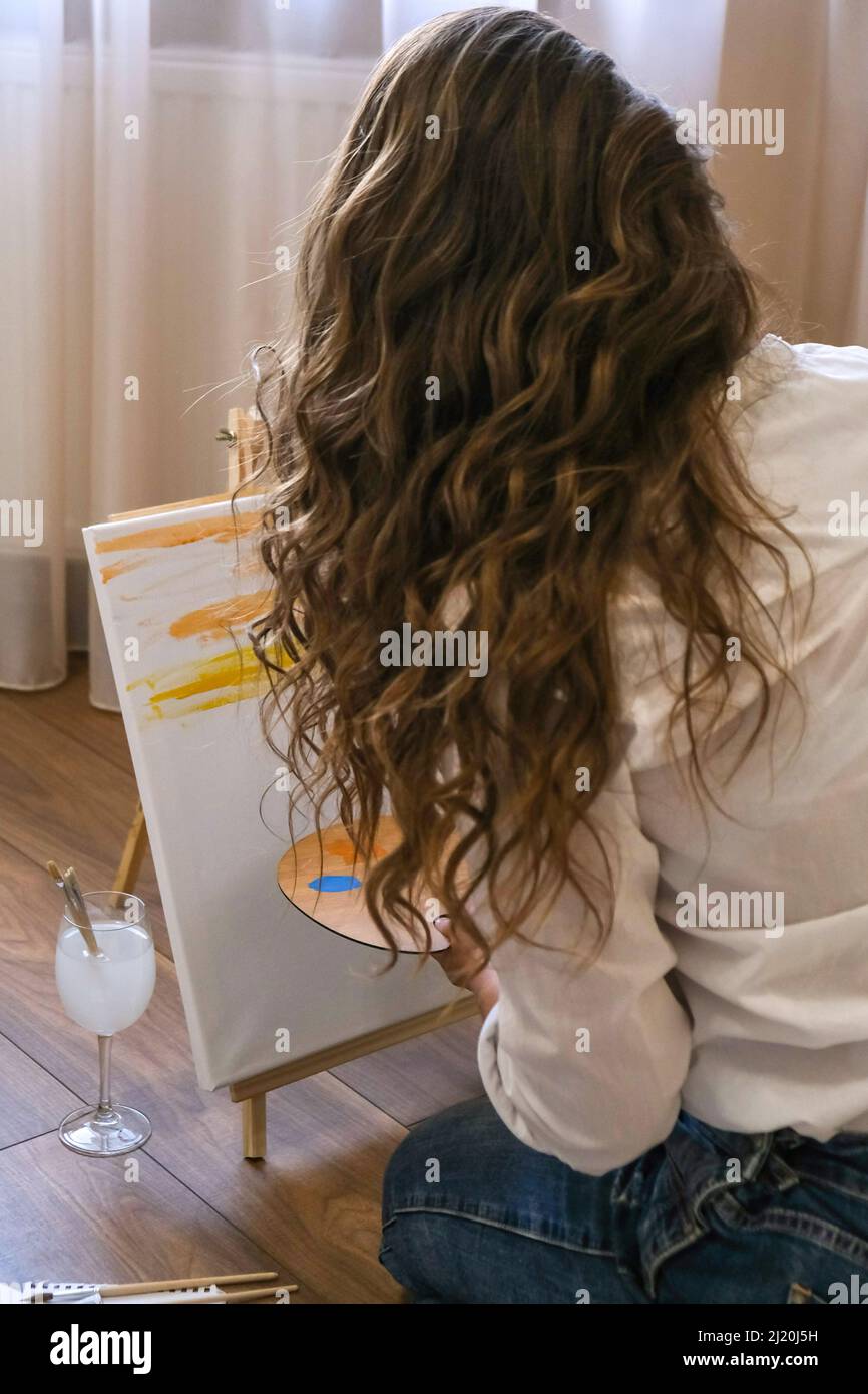 Creative painter in working process. Artist workplace, hobby, craft ...