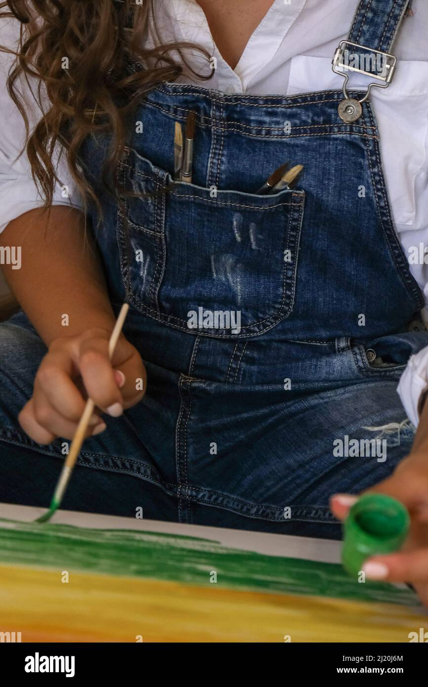 Creative painter in working process. Artist workplace, hobby, craft ...