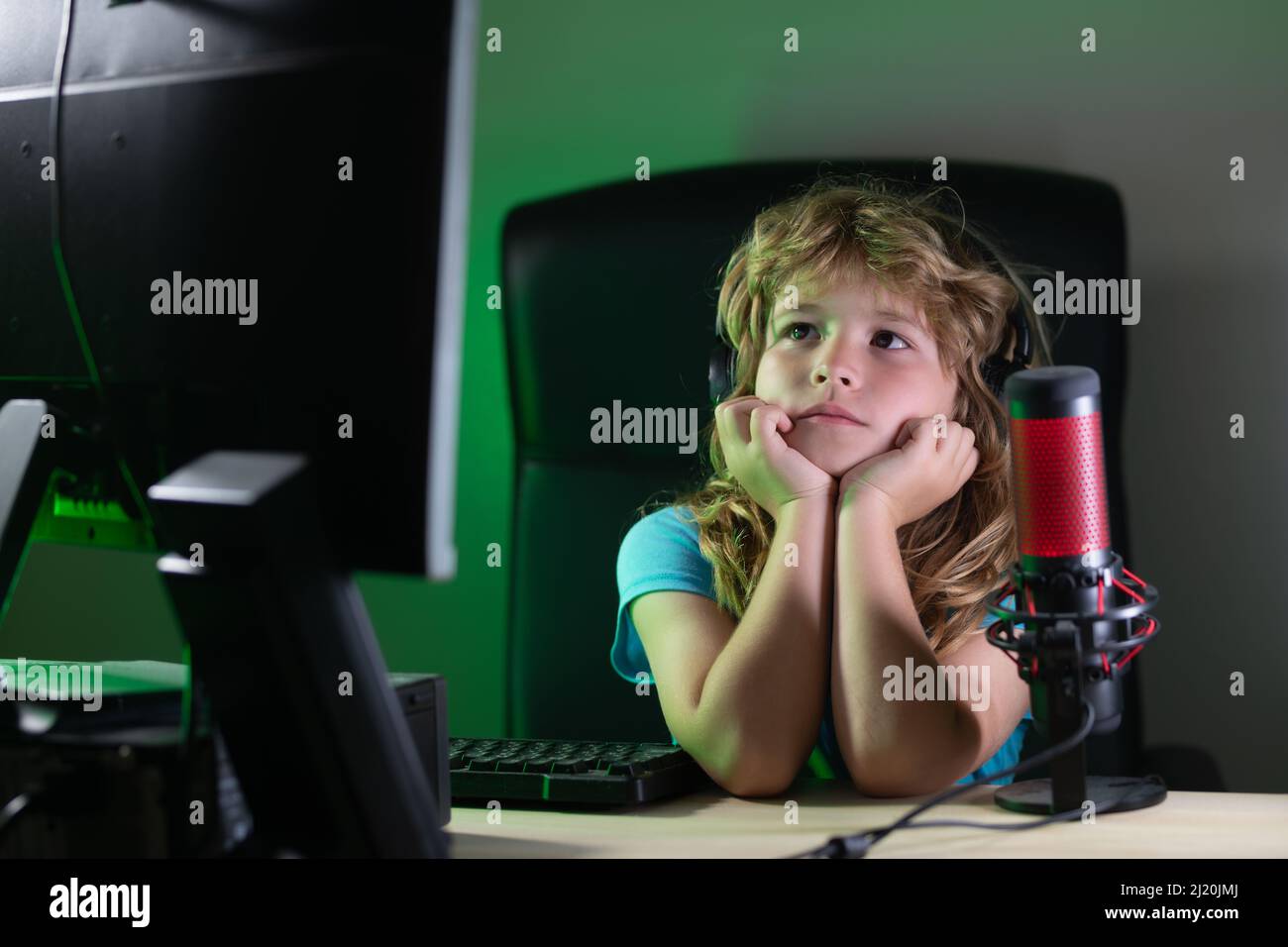 Cute preschool kid watching video lesson by laptop Stock Photo - Alamy