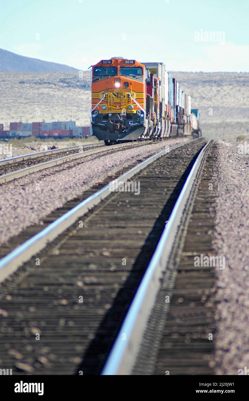 Train crossing the Mojave Desert of Southern California CA, pulling box cars Stock Photo - Alamy