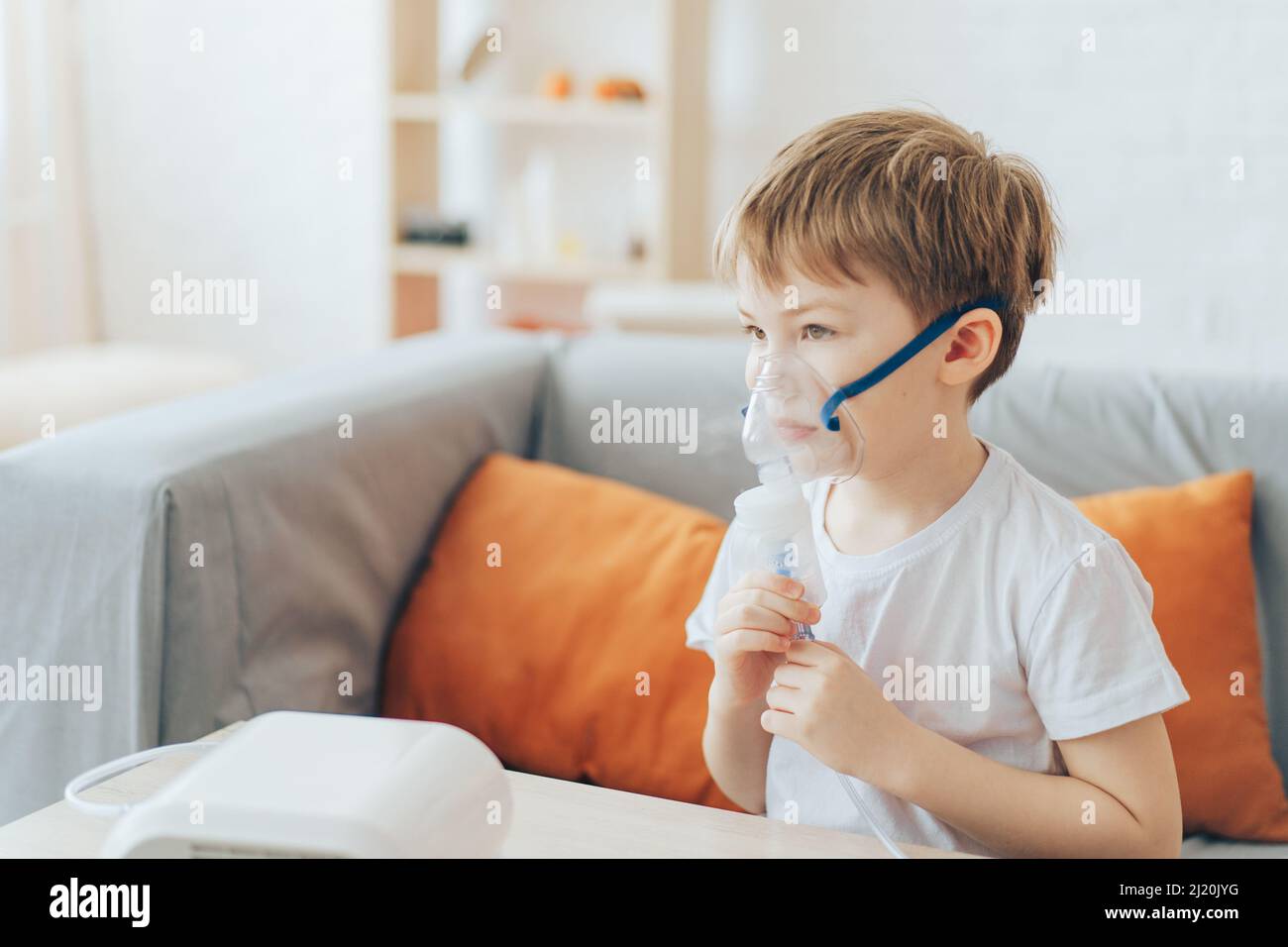 Sad little boy in mask from nebulizer close-up Stock Photo - Alamy