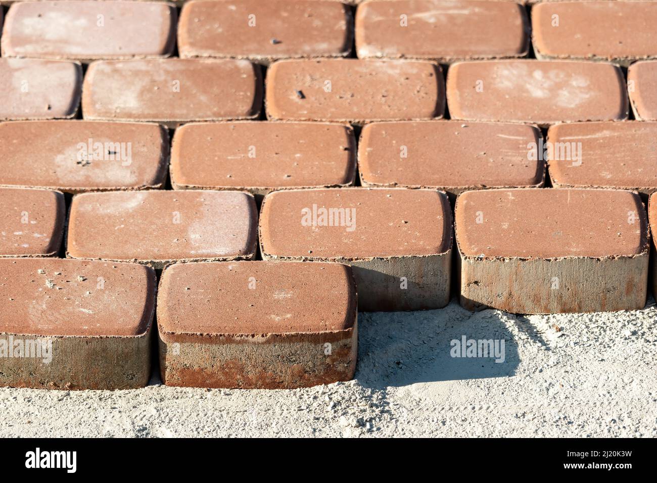 Brown concrete permeable flooring assembled on a substrate of sand ...