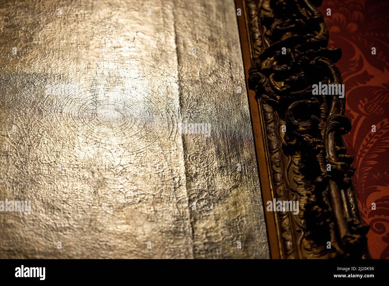 Close up detail of the surface texture of a historic oil painting in an ...