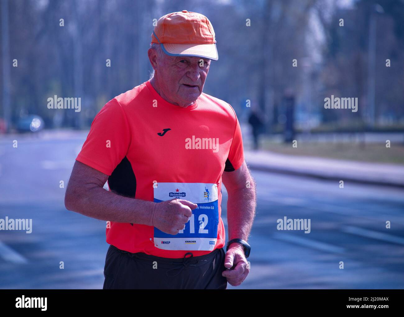 Active senior man running marathon Stock Photo - Alamy