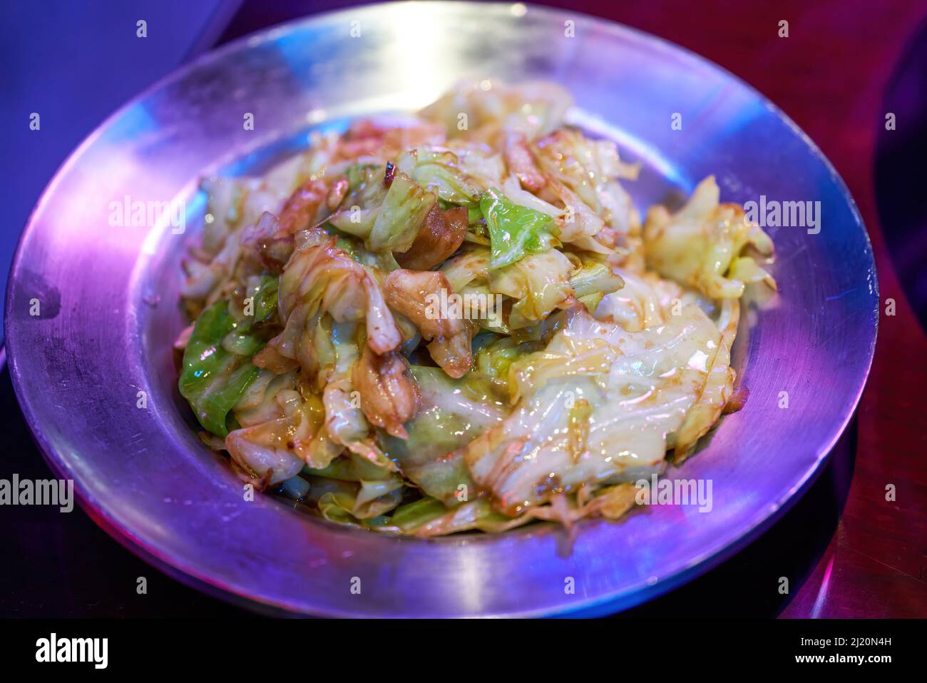 A delicious Chinese home-cooked dish, shredded and fried cabbage Stock ...