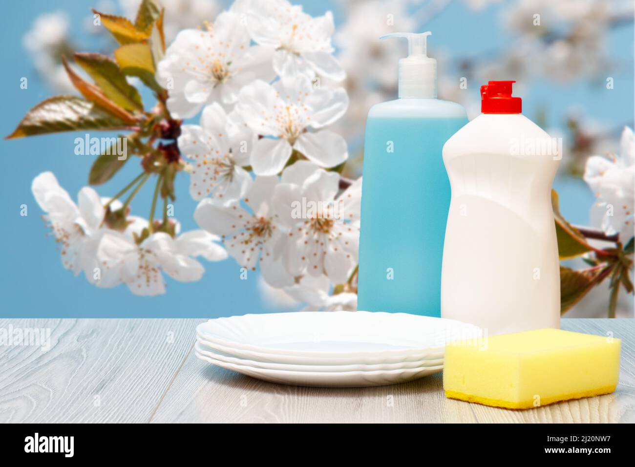 Plastic bottles of dishwashing liquid, glass and tile cleaner, clean ...