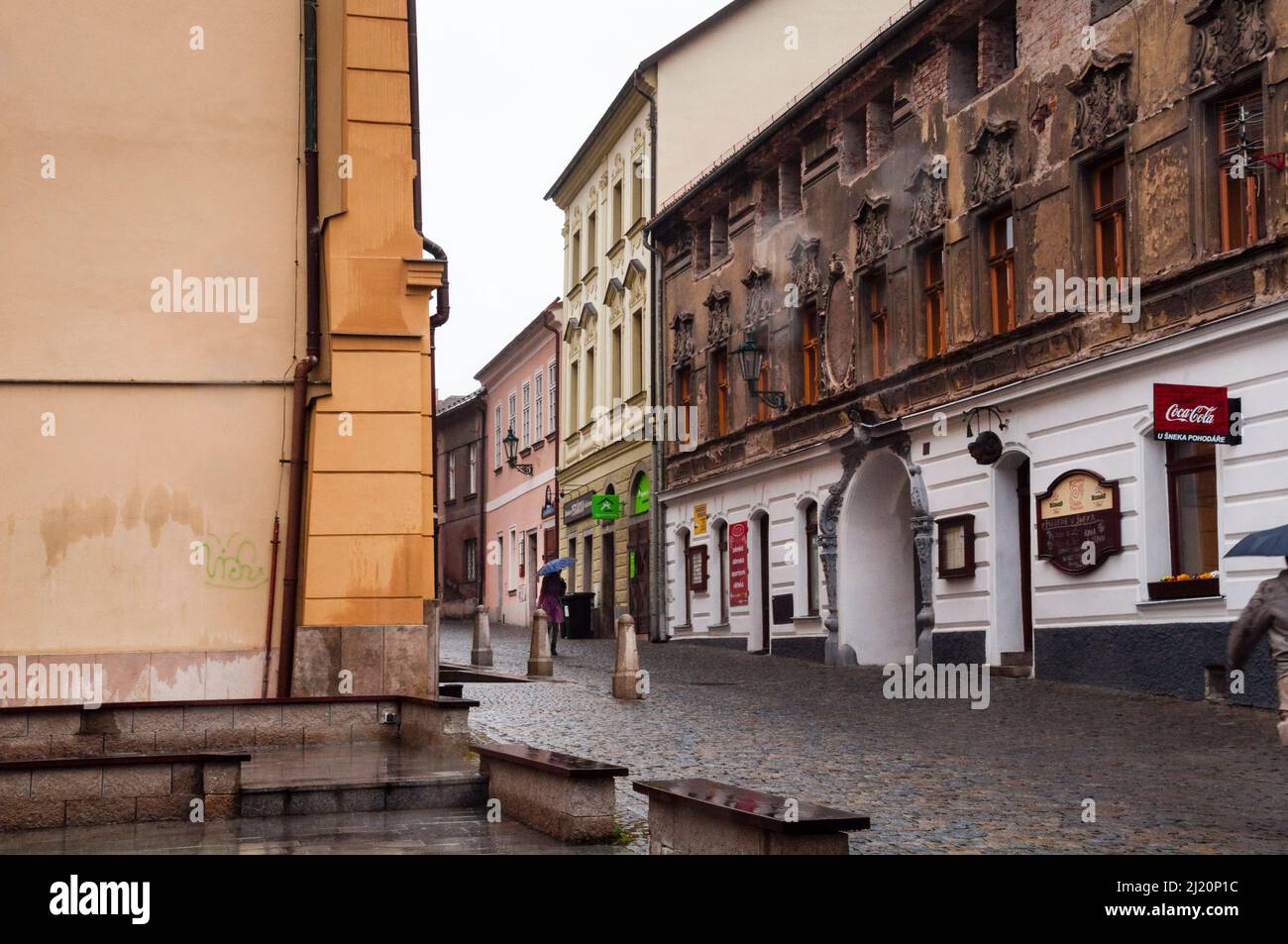 Baroque arched entrance and window pediments in the well preserved town ...