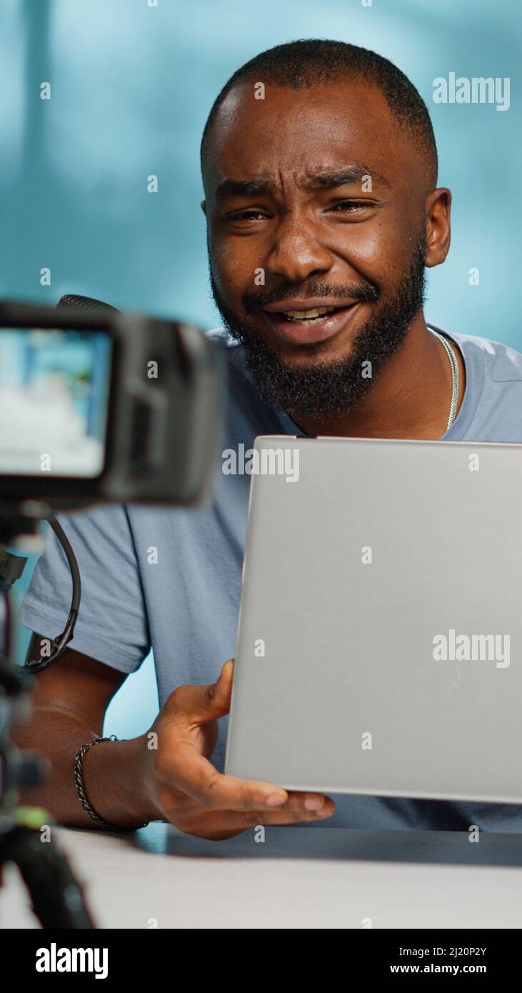Vlogger reviewing modern laptop channel hi-res stock photography and ...