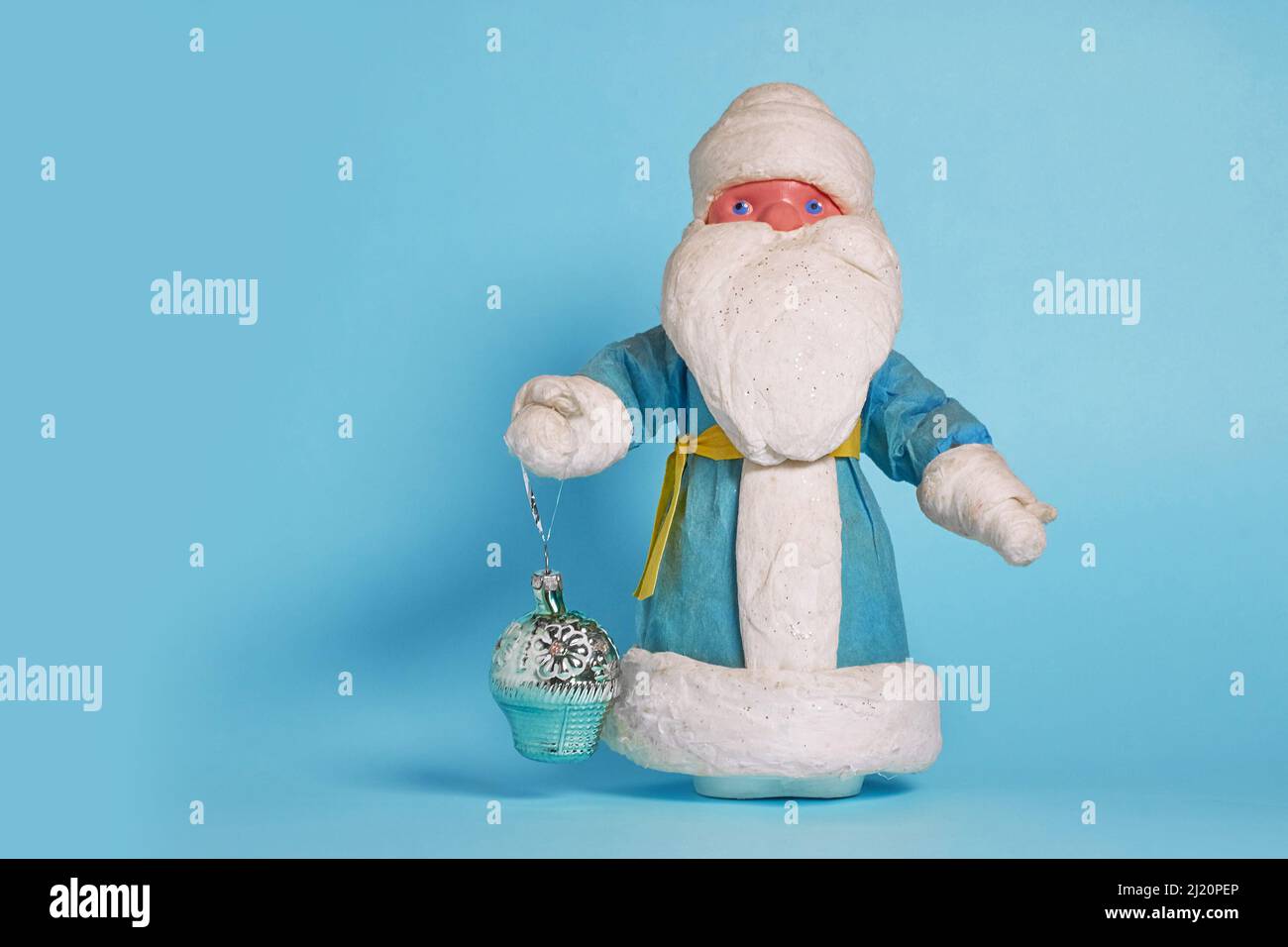 Toy Russian Ded Moroz holds Christmas tree toy in his hand Stock Photo ...