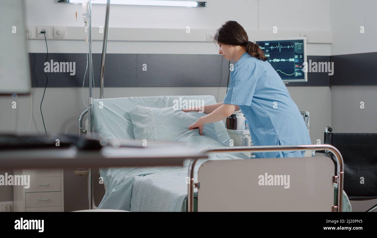 Nurse making bed in hospital hi-res stock photography and images - Alamy