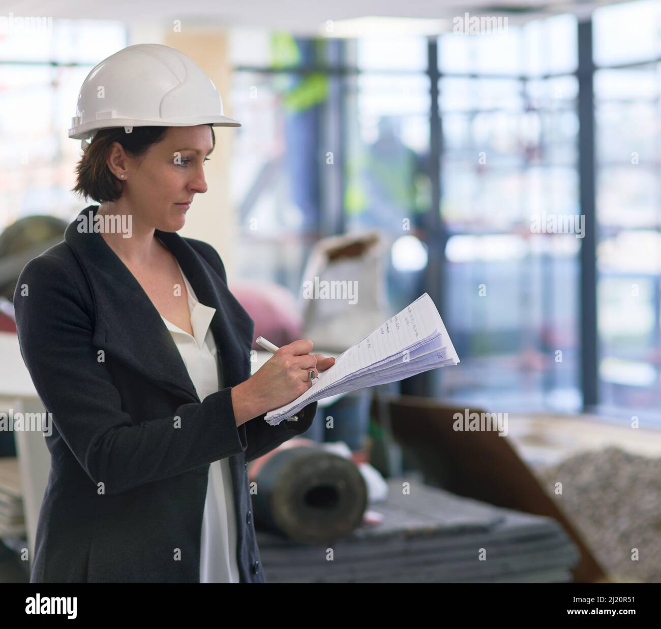 Watching her vision come to life. Shot of a female construction manager ...