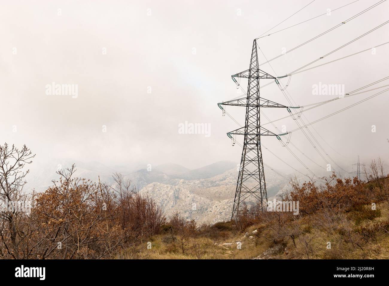 Power line in a mountains Stock Photo - Alamy