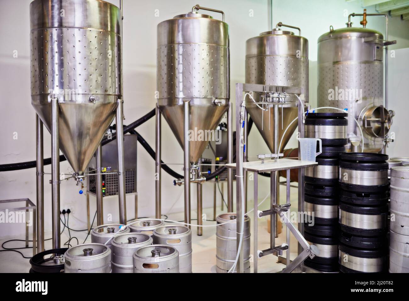 Waiting on the next batch. Shot of steel tanks in a brewery Stock Photo ...