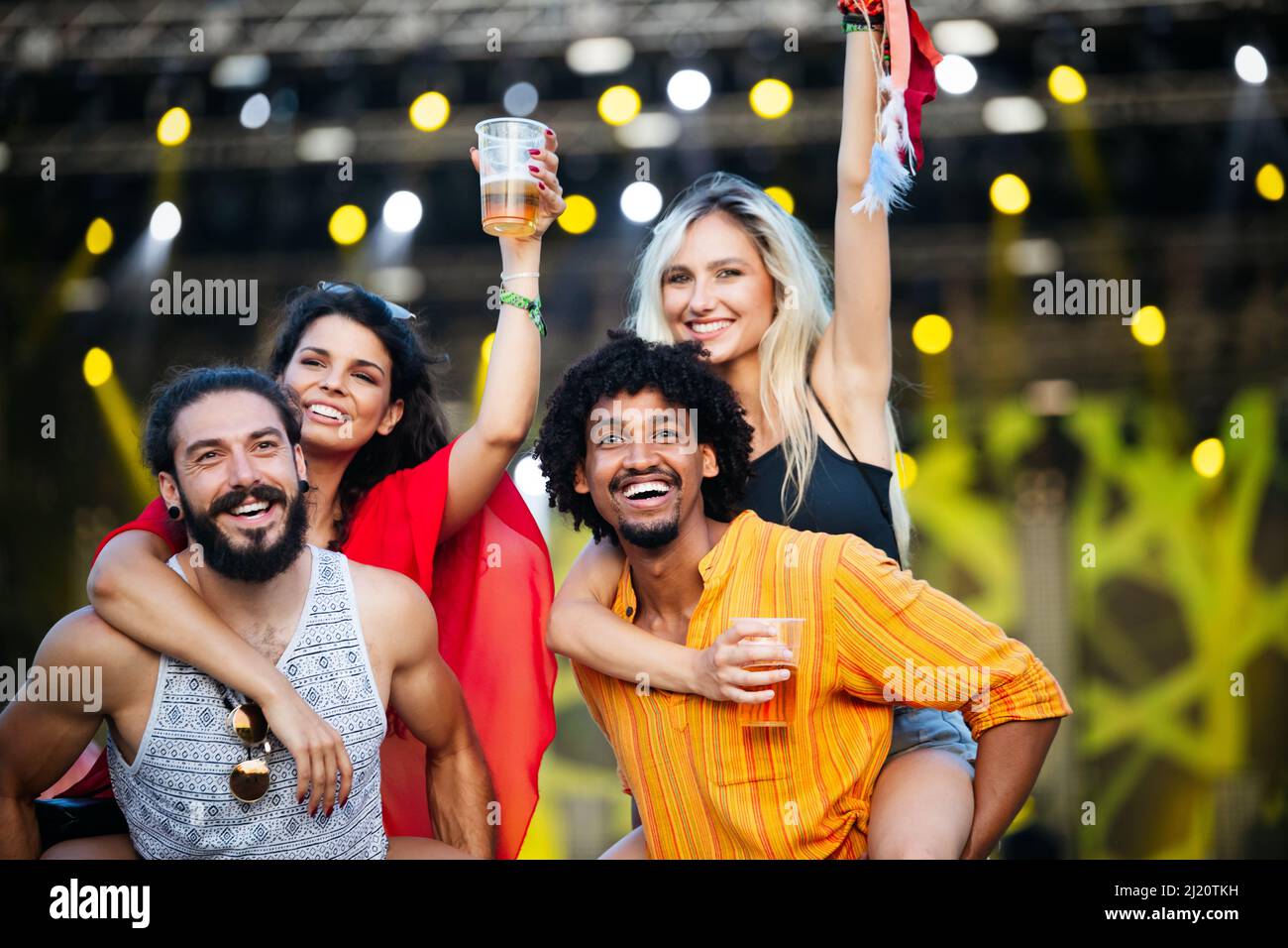 Cheerful happy group of friends partying in club at night Stock Photo ...