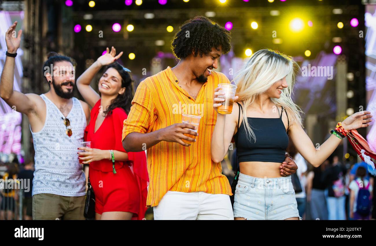 Happy friends laughing and having fun outdoors Stock Photo - Alamy