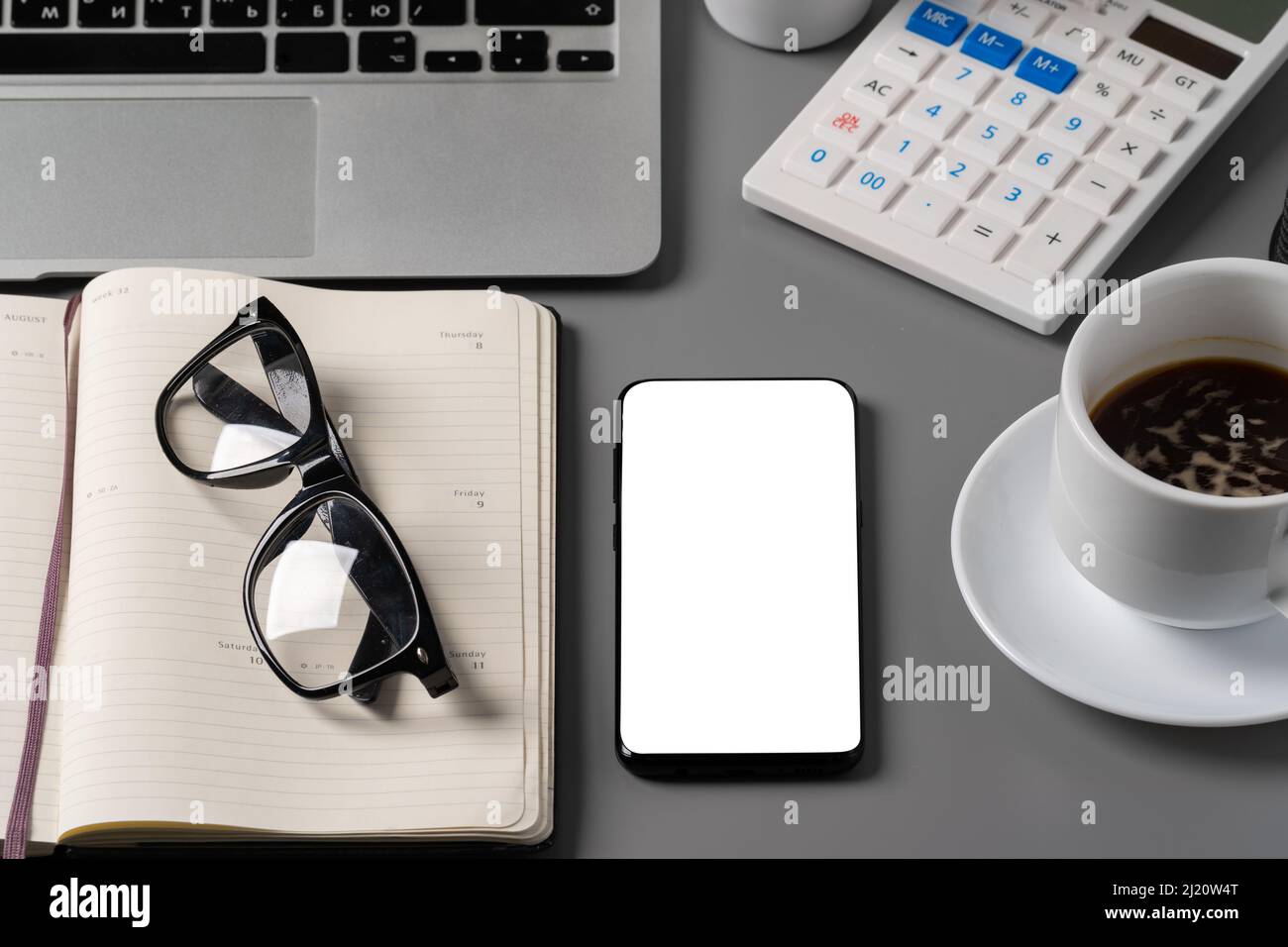 Notepad is on top of office desk table with laptop and supplies Stock ...