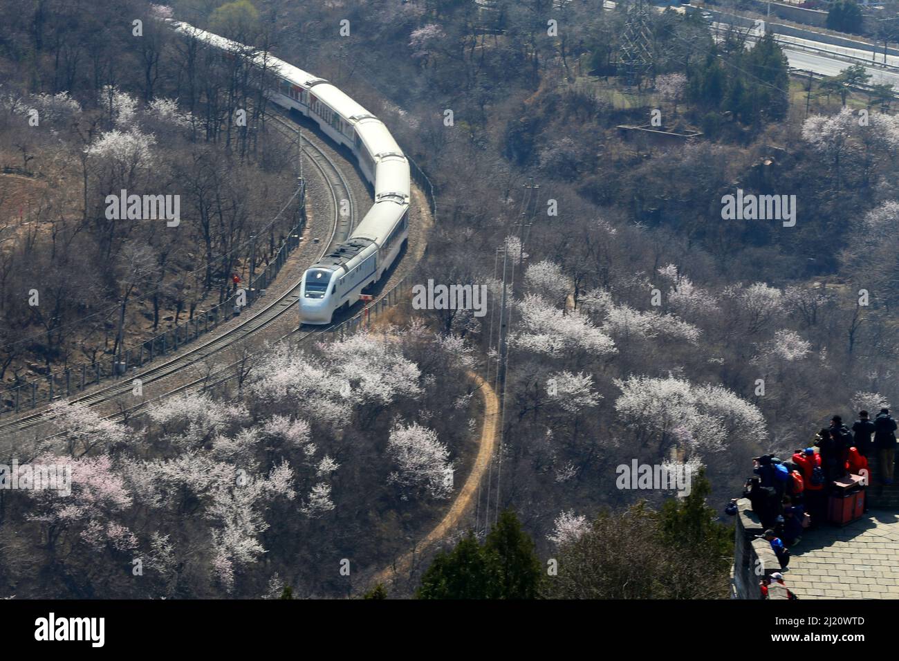 BEIJING, CHINA - MARCH 28, 2022 - A train runs at the foot of ...