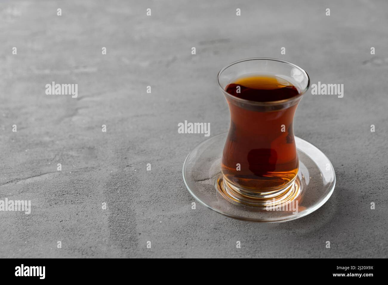 Turkish tea in traditional glass on gray background Stock Photo - Alamy Turkish tea in traditional glass on gray background Stock Photo - Alamy