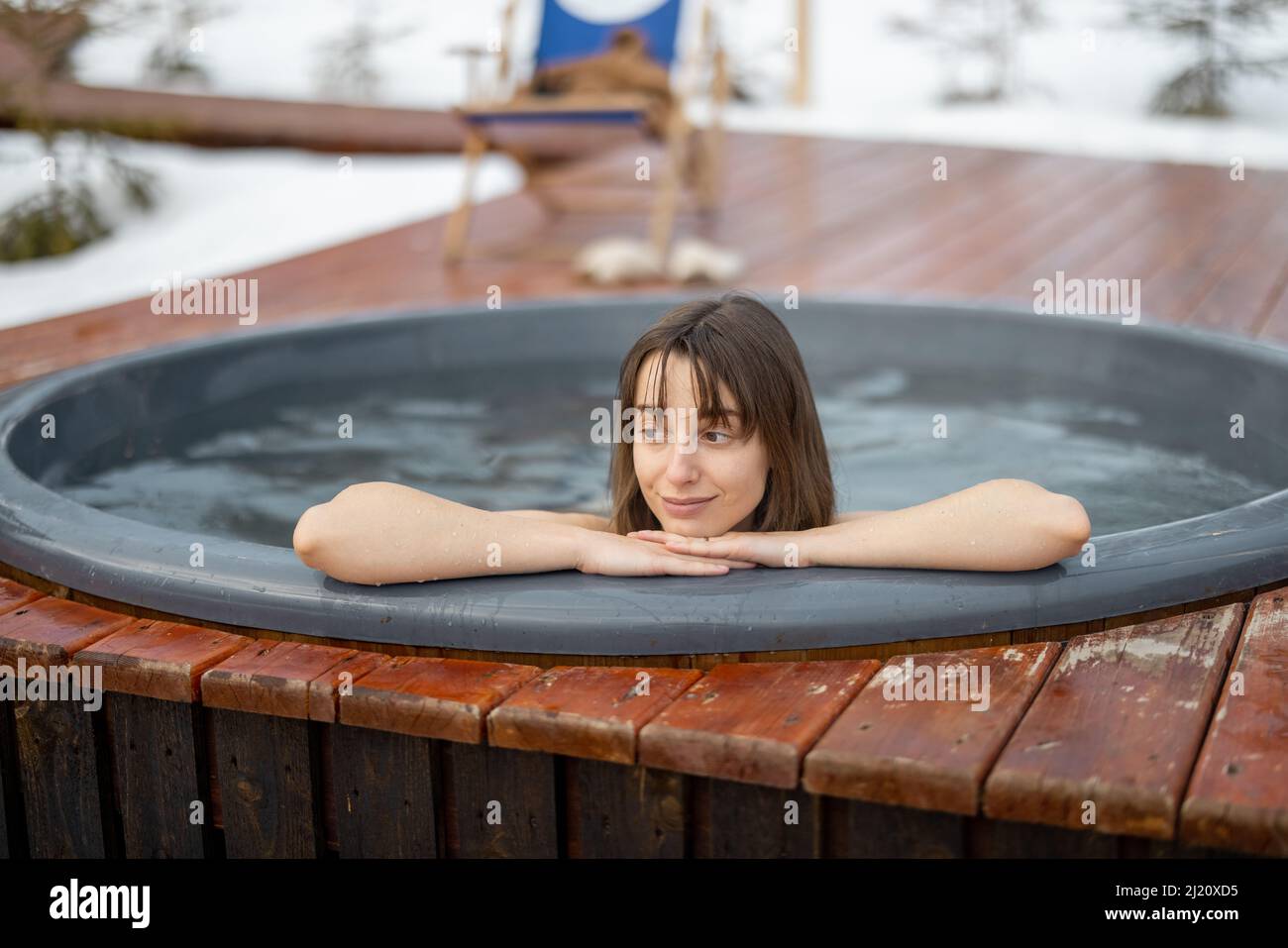 Woman bathing in hot tub at mountains Stock Photo - Alamy