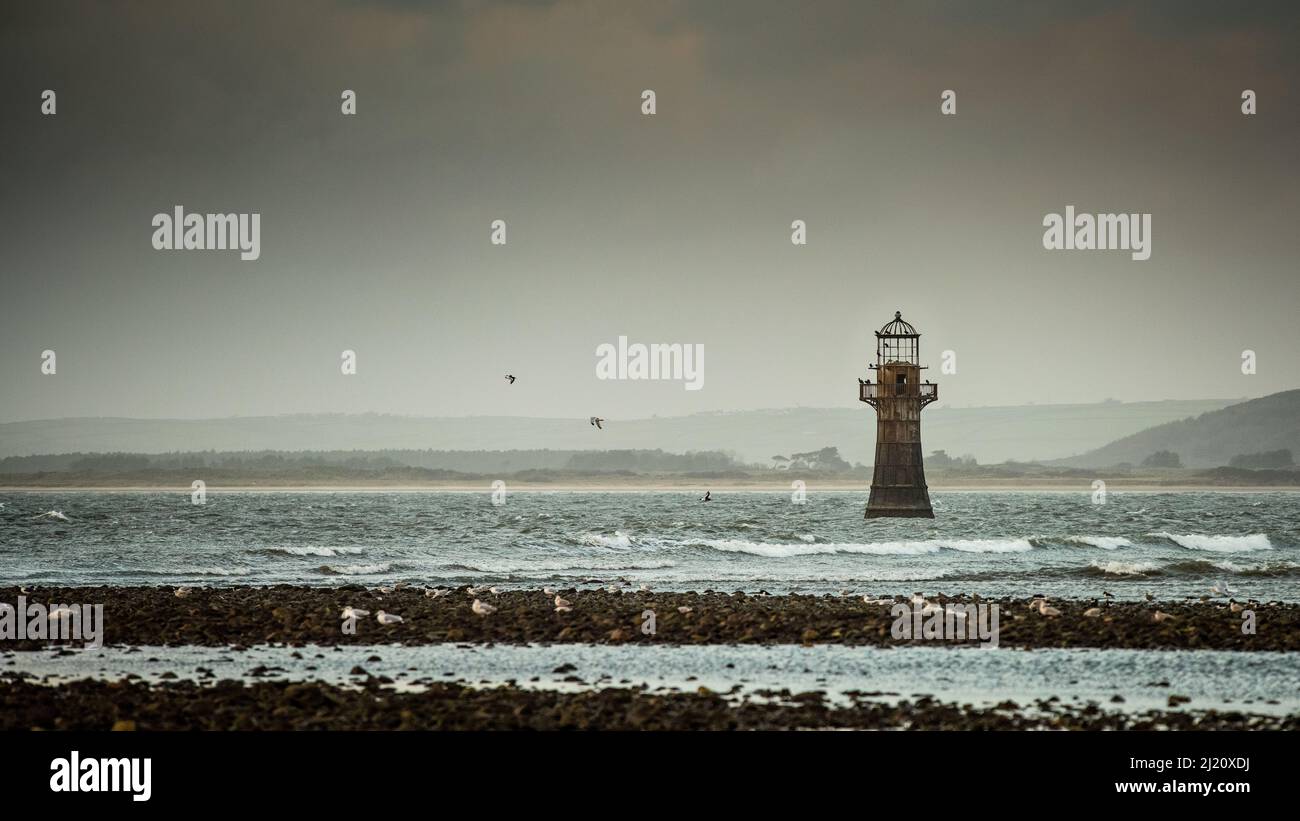 The Whiteford Point Lighthouse is located off the coast at Whiteford ...