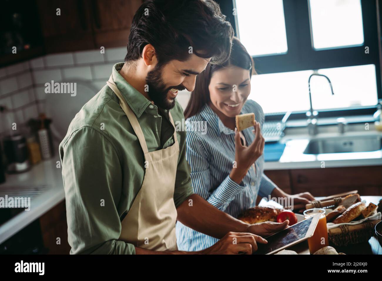 Couple cooking food happiness hobby liefstyle concept Stock Photo - Alamy