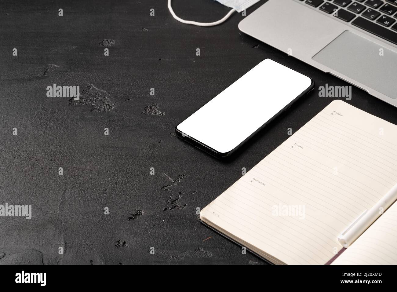 Notepad is on top of office desk table with laptop and supplies Stock ...