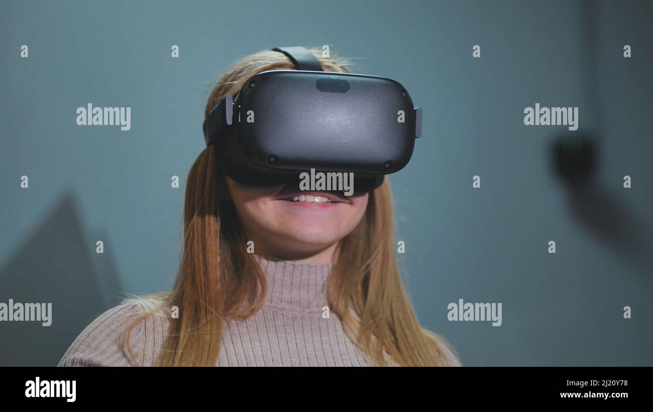 The girl plays virtual reality games in the club Stock Photo - Alamy
