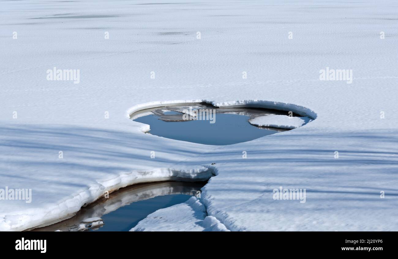 A heart shaped water hole in ice cover Stock Photo - Alamy