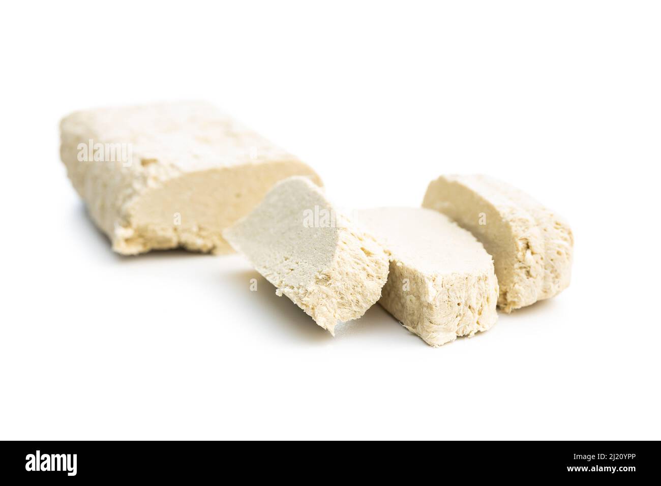 Sweet tahini halva. Turkish dessert isolated on white background Stock Photo - Alamy