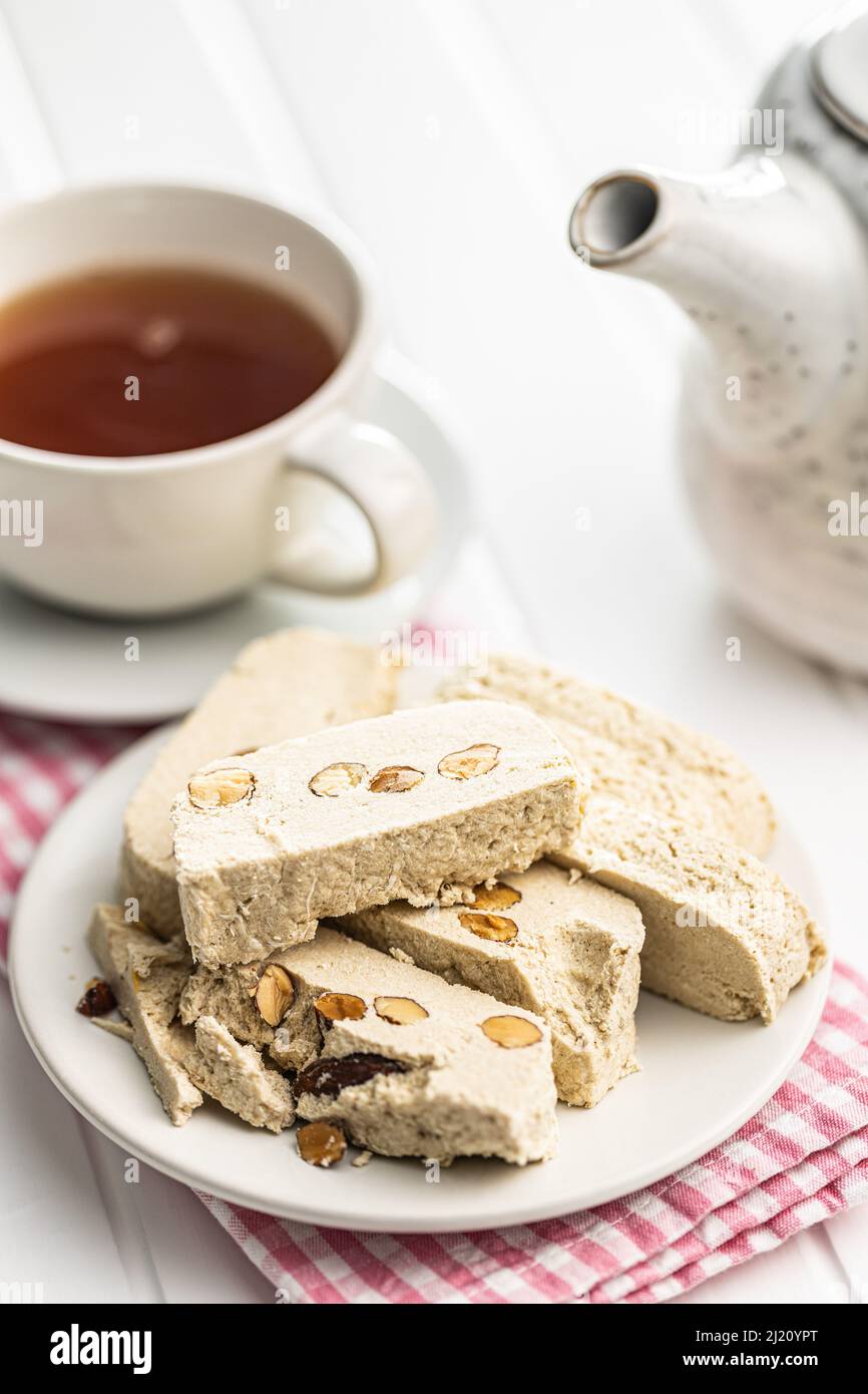 Sweet tahini halva with almonds. Turkish dessert on the plate Stock ...