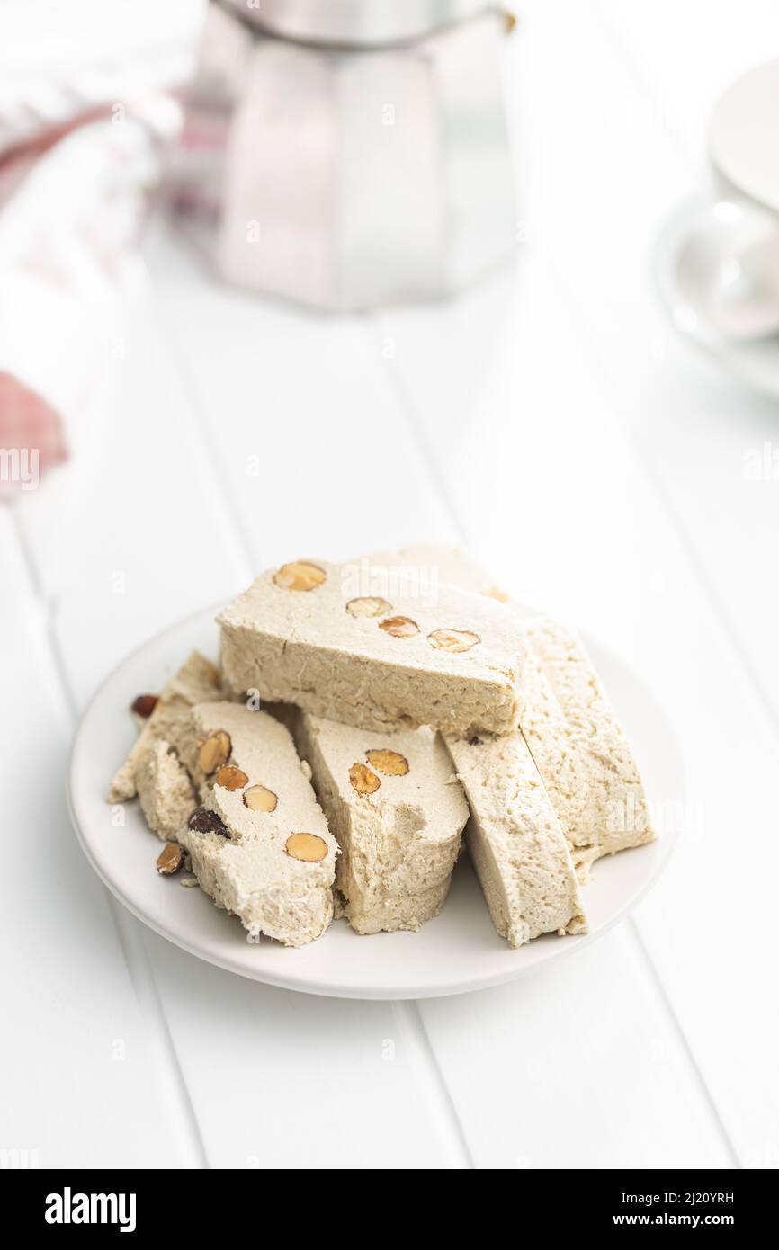 Sweet tahini halva with almonds. Turkish dessert on the plate Stock ...