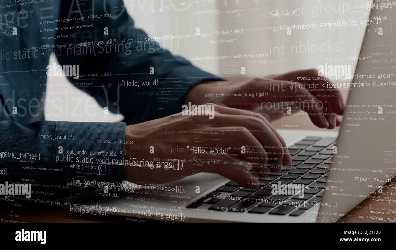 Computer Programmer Uses Capable Laptop Computer To Develop Programming Code Of New Software