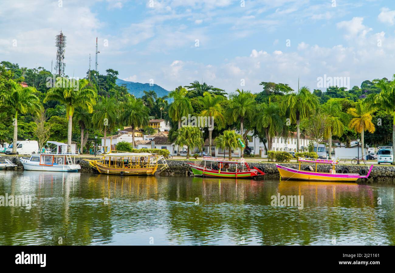 A beautiful shot of Small tourist boats in the main port of Paraty with ...