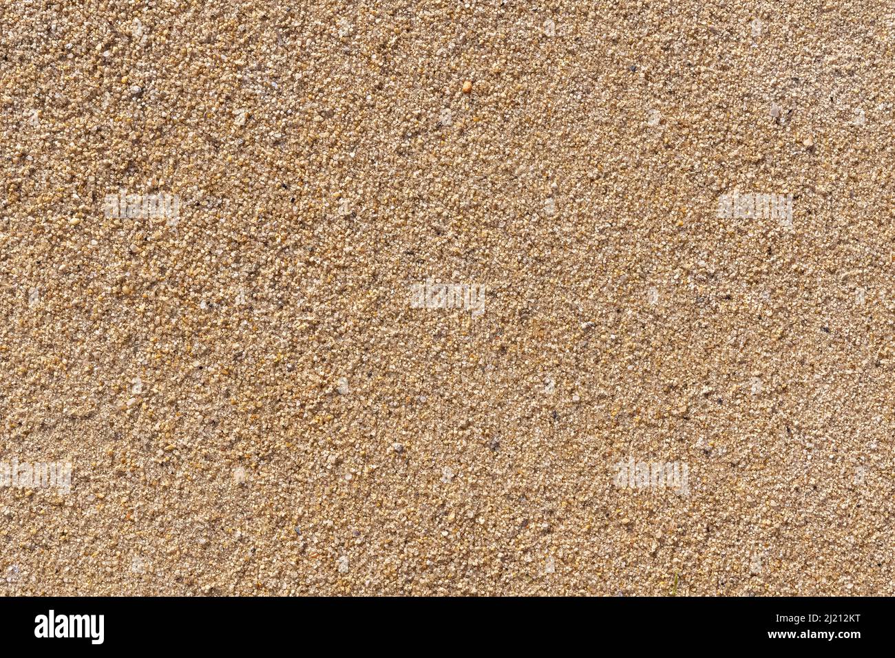 Small grains of sand on a beach, colorful background Stock Photo - Alamy