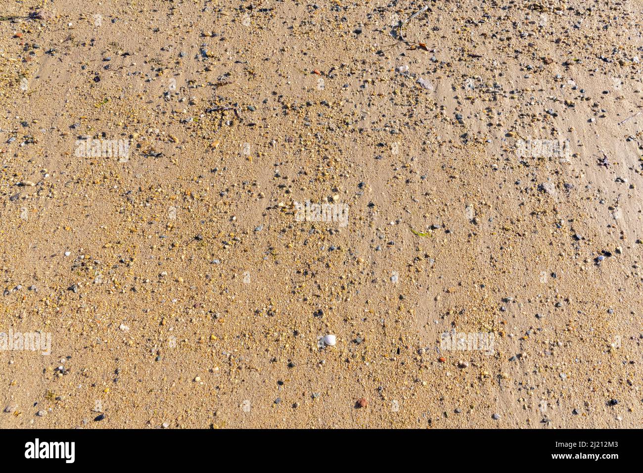 Small grains of sand on a beach, colorful background Stock Photo - Alamy