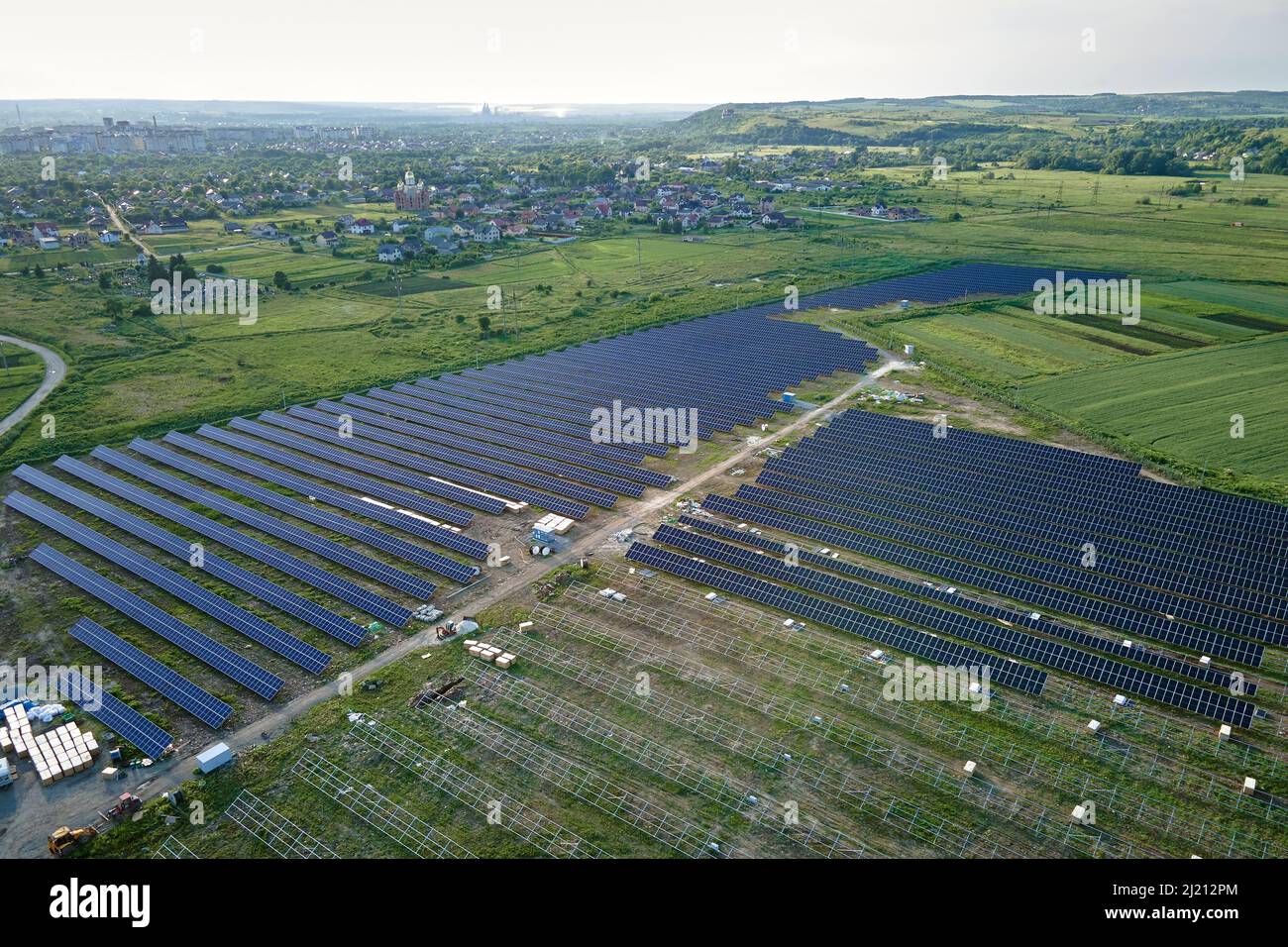 Aerial view of big electric power plant under construction with many ...