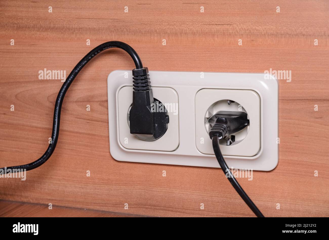 Power outlet or sockets on brown wooden wall indoors, Germany, Europe ...