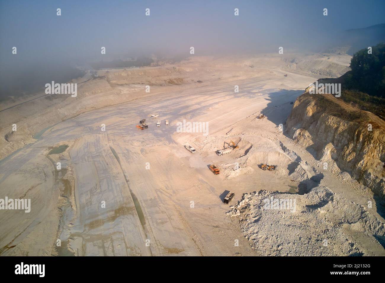 Aerial view of open pit mining of limestone materials for construction ...