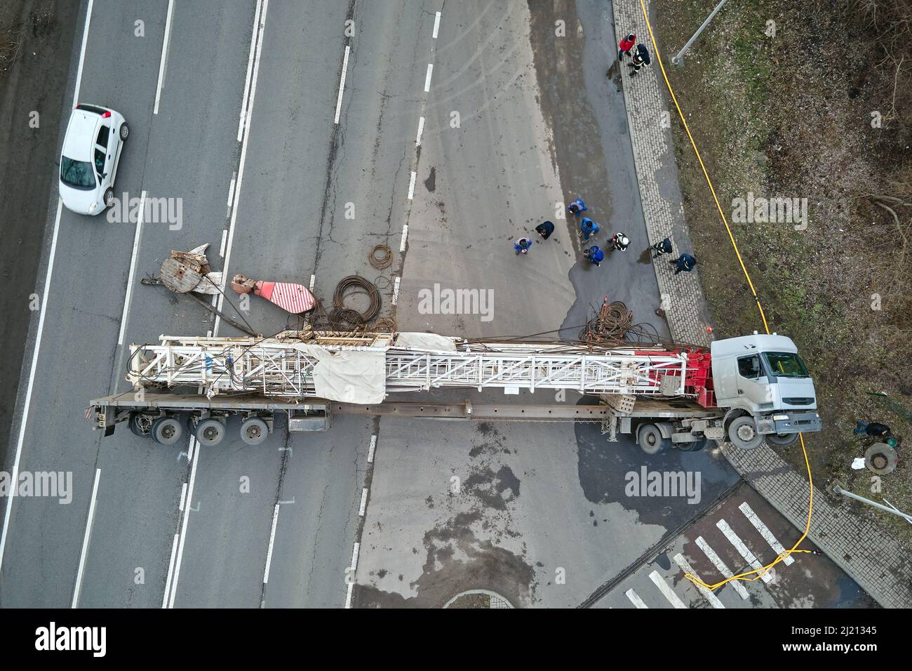 Aerial view of road accident with overturned truck blocking traffic ...